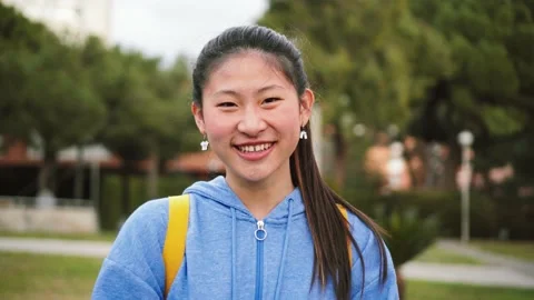 Young chinese lady student smiling looki... | Stock Video | Pond5