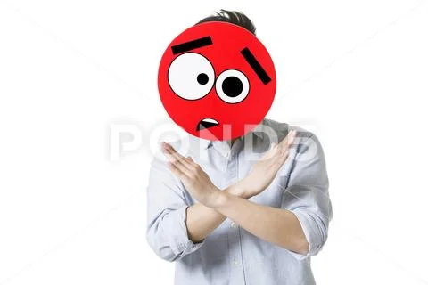 Young Chinese man with a confused emoticon face in front of his face ...