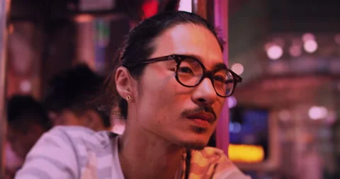 Young chinese man looking out window at ... | Stock Video | Pond5