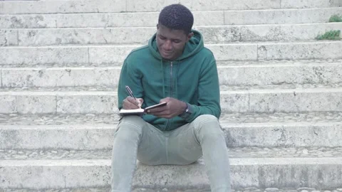young confident black man notes on his d... | Stock Video | Pond5