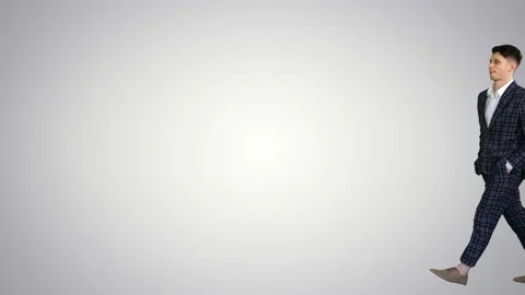 Young cool elegant man walking by on gra... | Stock Video | Pond5