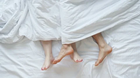 Young couple crosses legs stuck out of s... | Stock Video | Pond5