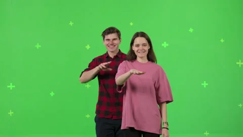 young couple is dancing on a green scree... | Stock Video | Pond5