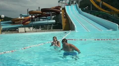 Young couple going out the pool with wat... | Stock Video | Pond5