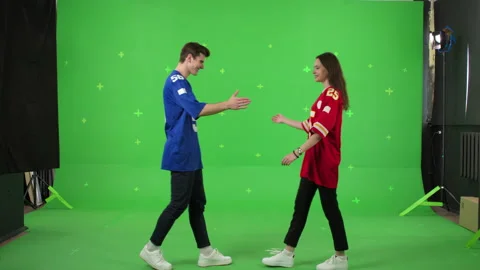 young couple greeting on green screen ba... | Stock Video | Pond5