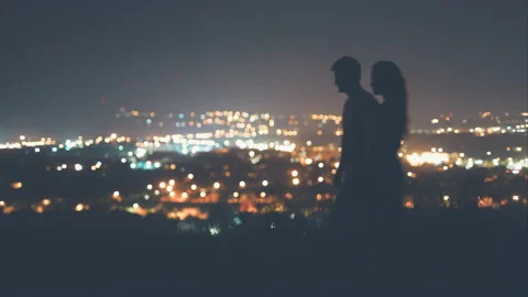 The young couple kisses on the night cit... | Stock Video | Pond5