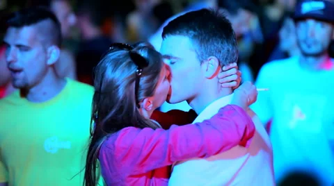 Young couple kissing on the beach party ... | Stock Video | Pond5