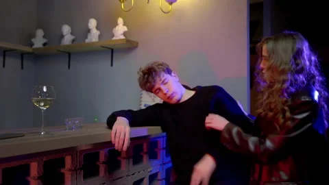 A young couple meets in a nightclub bar | Stock Video | Pond5