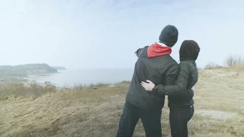 A young couple ran to a beautiful sea ba... | Stock Video | Pond5
