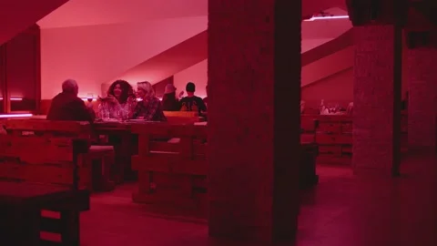 Young couple sitting inside restaurant t... | Stock Video | Pond5