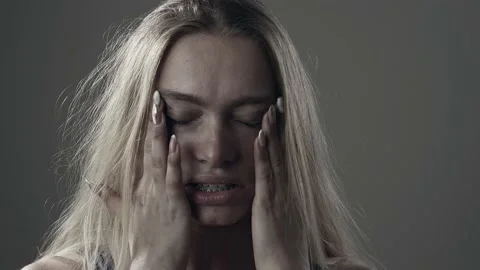 Young crying woman victim of domestic vi... | Stock Video | Pond5