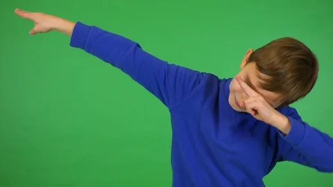 A young cute boy dabs - green screen stu... | Stock Video | Pond5
