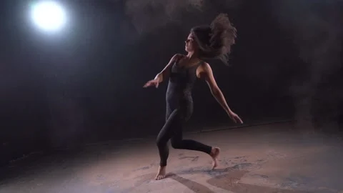 young dancer woman is dancing in dusty d... | Stock Video | Pond5