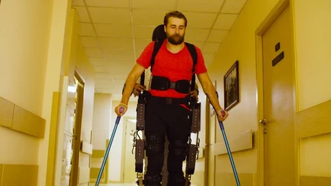 Young disable man walking in the robotic... | Stock Video | Pond5