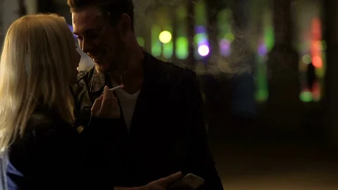 Young drunk couple kissing and smiling a... | Stock Video | Pond5