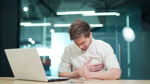 A young employee suffers a heart attack ... | Stock Video | Pond5