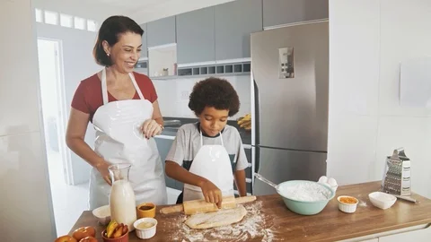 Young family cooking food in kitchen. Ha... | Stock Video | Pond5