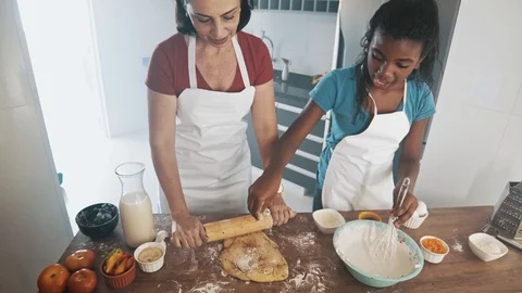 Young family cooking food in kitchen. Ha... | Stock Video | Pond5