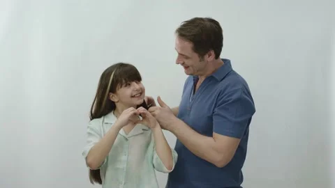 A young father on a white background is ... | Stock Video | Pond5