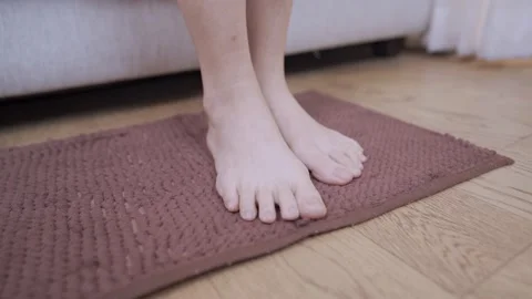 A young female barefoot step down and up... | Stock Video | Pond5