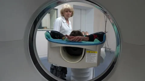 Young female patient lying on a ct or mr... | Stock Video | Pond5