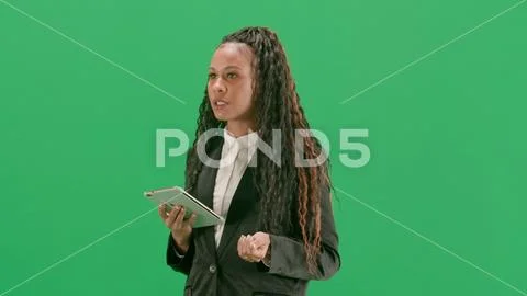 Young female reporter isolated on chroma key green screen background ...