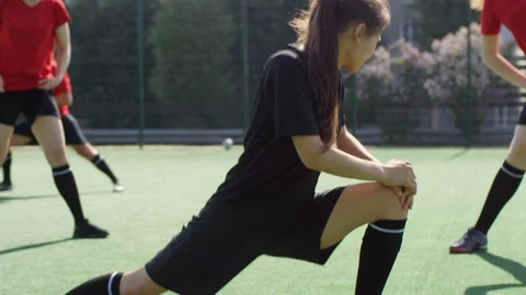Young Female Soccer Players Stretching L... | Stock Video | Pond5