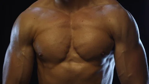 Young fit guy showing chest muscles, loo... | Stock Video | Pond5