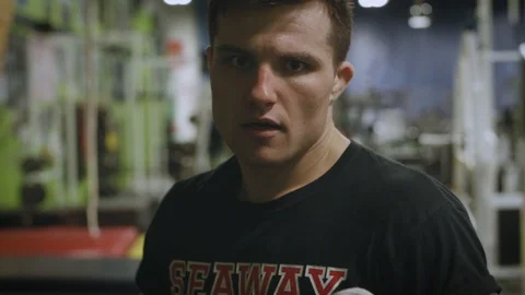 Young focused MMA fighter throws a punch... | Stock Video | Pond5