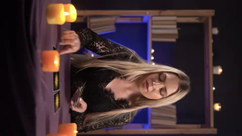 Young Fortune teller reading a future by... | Stock Video | Pond5