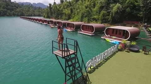 Young Girl in Bikini Jumping from Tower ... | Stock Video | Pond5