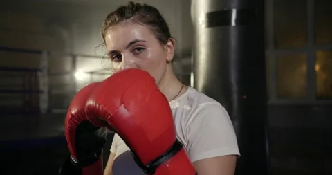 Young girl boxing in the gym at night ag... | Stock Video | Pond5