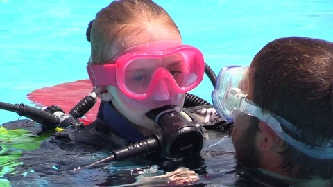 Young girl child scuba diver swim and di... | Stock Video | Pond5