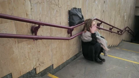 A young girl crying by the stairs in the... | Stock Video | Pond5