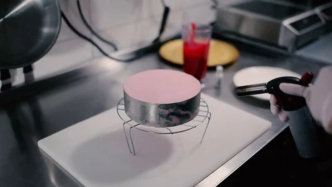 Young girl doing with a burner cake form... | Stock Video | Pond5