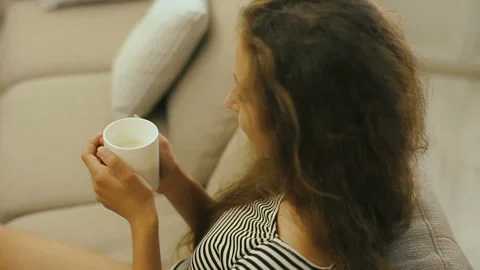 Young girl drinking fresh milk sitting o... | Stock Video | Pond5