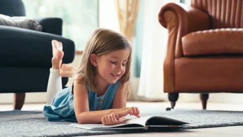 Young Girl At Home Lying On Floor Of Lou... | Stock Video | Pond5