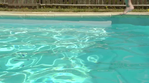Young Girl Jumping Into Outdoor Pool In ... | Stock Video | Pond5