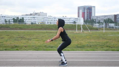 Young girl jumping on the spot in the st... | Stock Video | Pond5