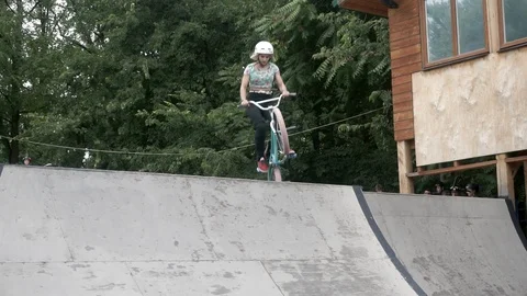 Young girl jumping on a springboard in t... | Stock Video | Pond5