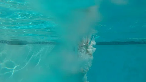 Young Girl Jumps Off Diving Board and Wa... | Stock Video | Pond5