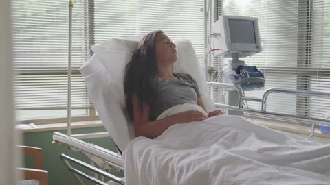 Young Girl Laying in Hospital Bed | Stock Video | Pond5