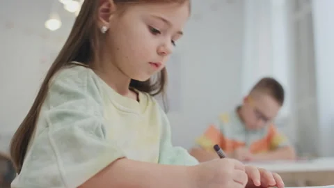 Young Girl with Long Hair Sitting at Tab... | Stock Video | Pond5
