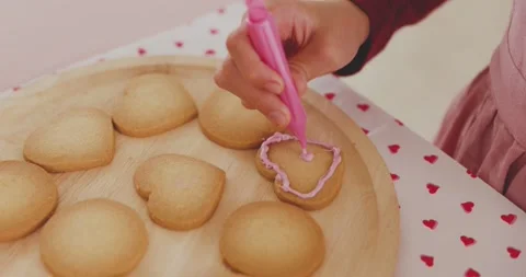 Young girl making sweets in the kitchen | Stock Video | Pond5