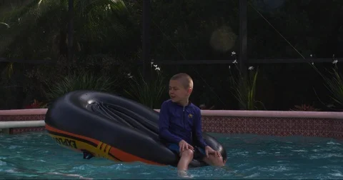 Young girl overshoots jump onto inflatab... | Stock Video | Pond5