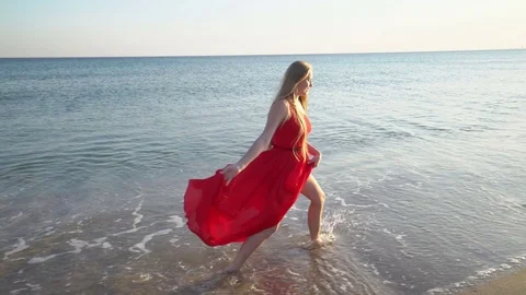 Young girl in red dress whirling and dan... | Stock Video | Pond5