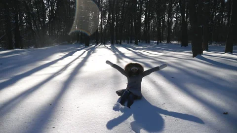 Young girl run and falling on white clea... | Stock Video | Pond5