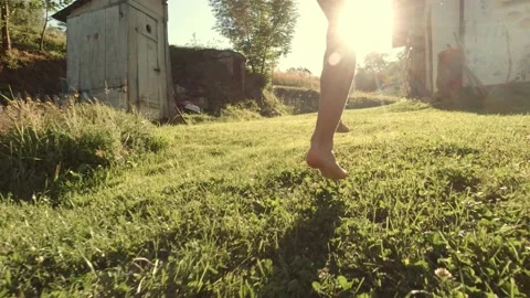 Young Girl Running Barefoot on Farm Gras... | Stock Video | Pond5