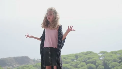 Young girl singing and dancing on viewpo... | Stock Video | Pond5