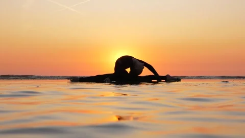Young girl sitting in split pose and ben... | Stock Video | Pond5